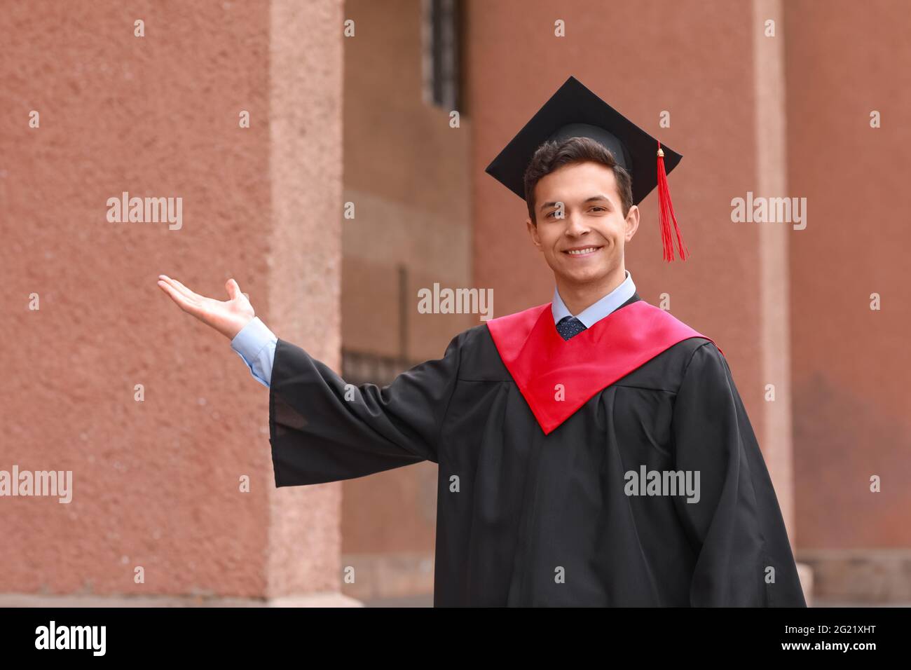 Portrait of male graduating student outdoors Stock Photo - Alamy