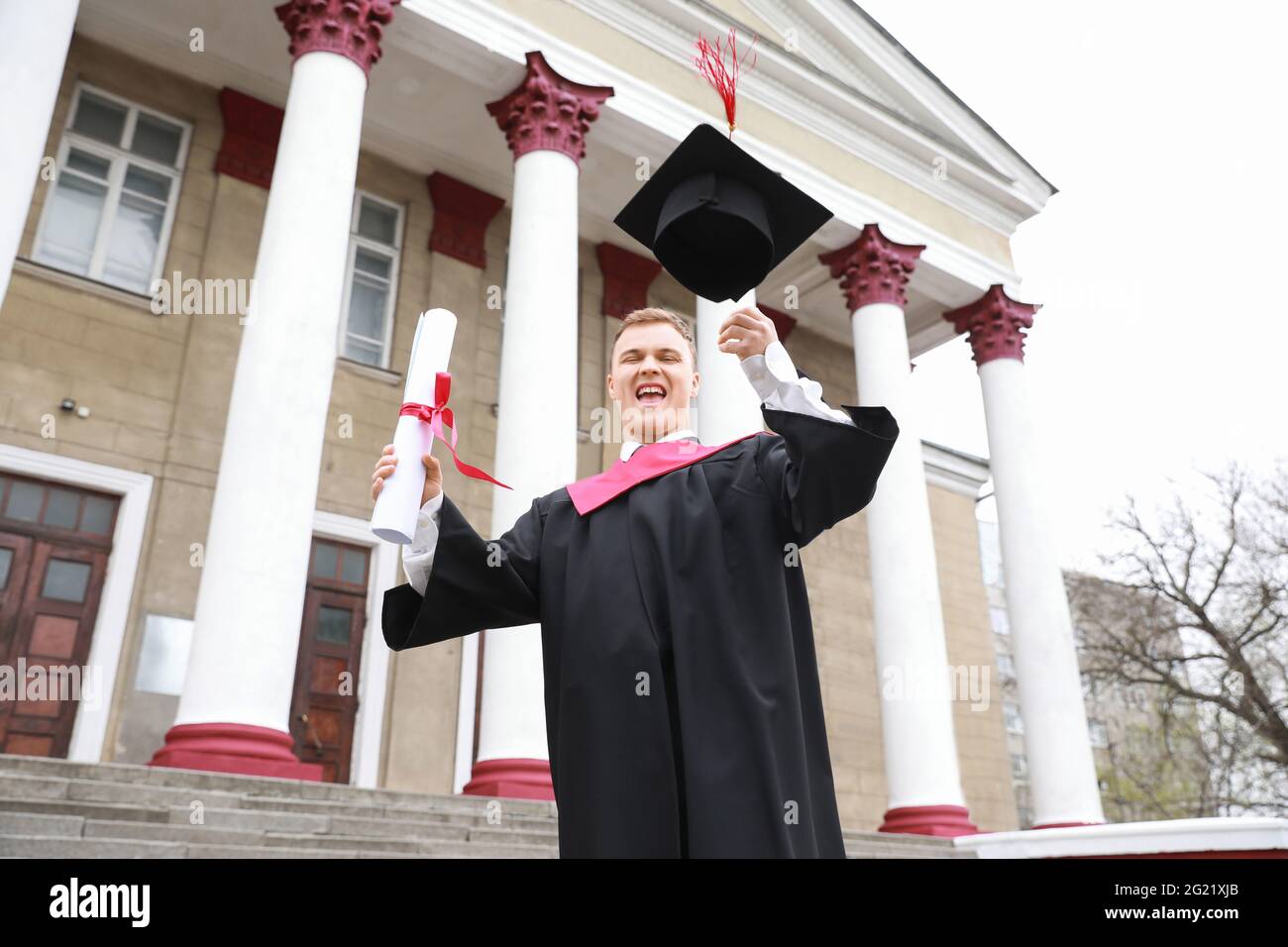 Portrait of male graduating student outdoors Stock Photo - Alamy