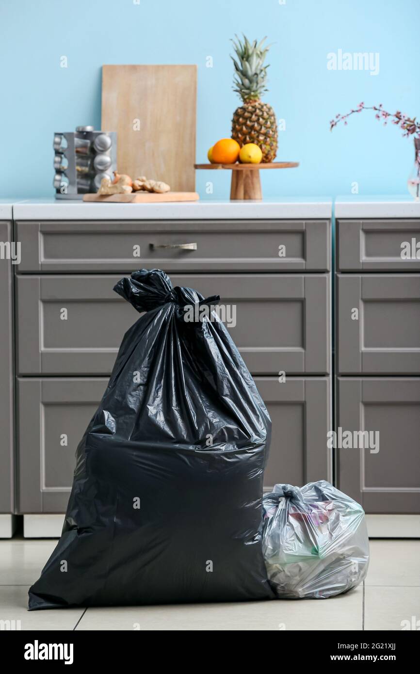 Bags with different garbage at home Stock Photo - Alamy