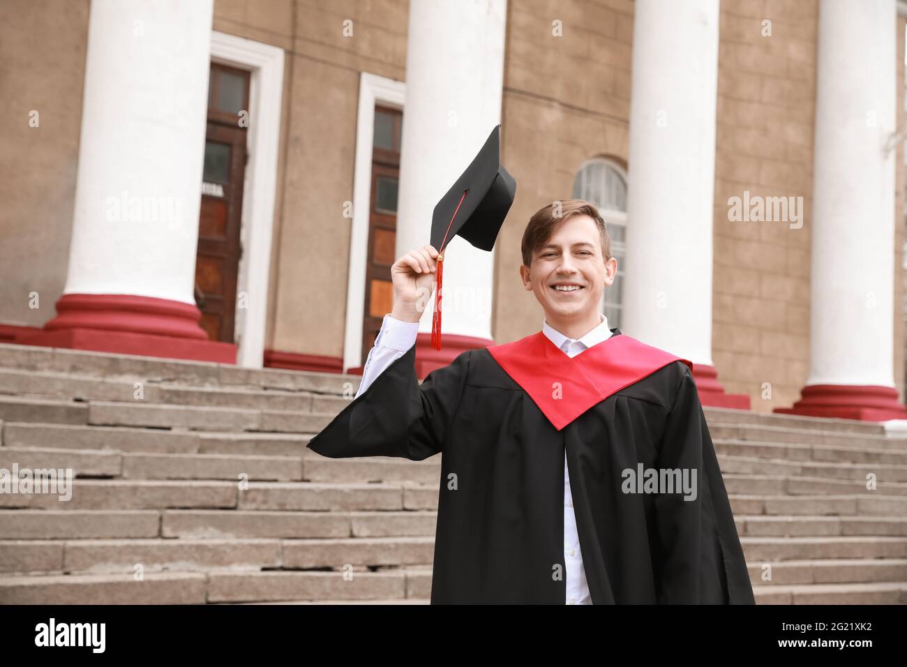 Portrait of male graduating student outdoors Stock Photo - Alamy