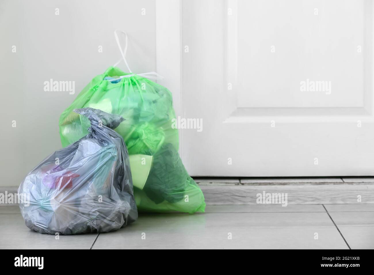 Bags with different garbage at home Stock Photo - Alamy