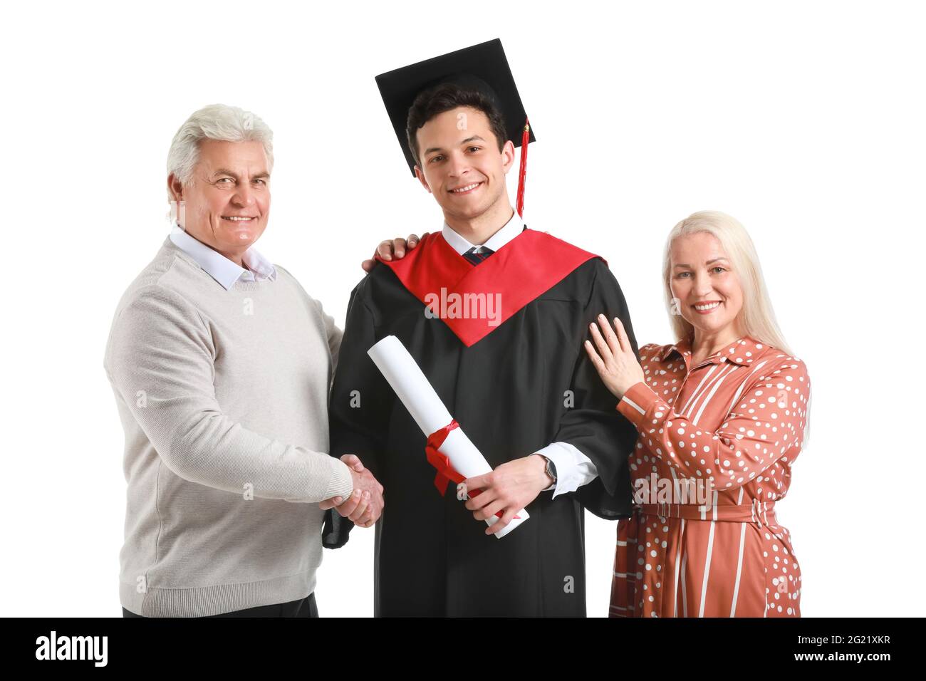 Happy male graduation student with his parents on white background ...