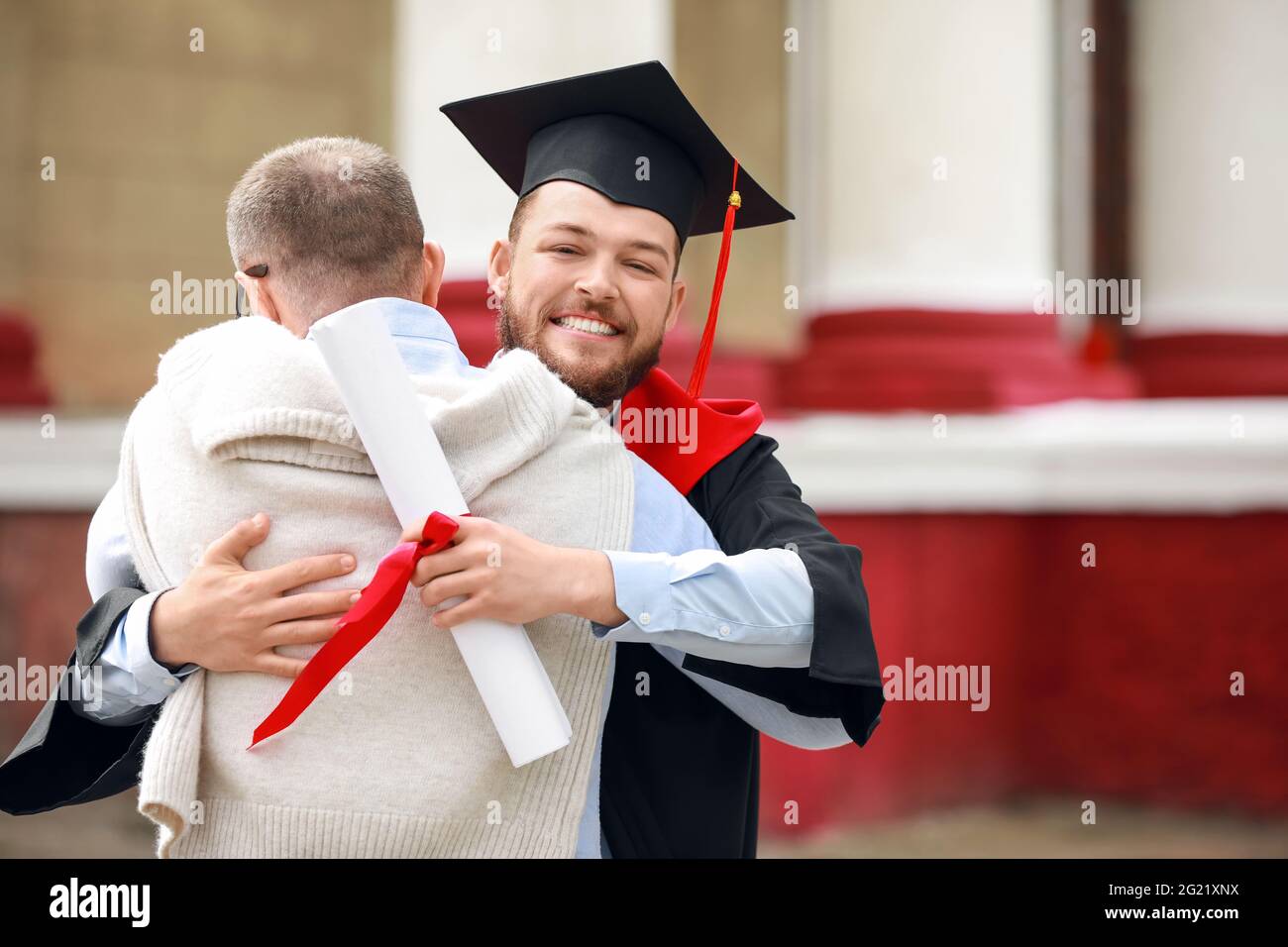 Happy young man with his father on graduation day Stock Photo - Alamy