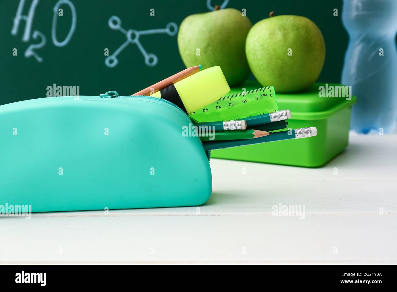 Pencil case with stationery on table Stock Photo - Alamy