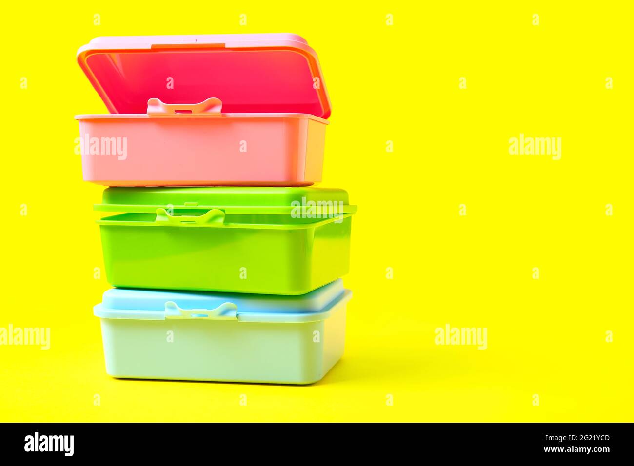 Plastic lunch boxes on color background Stock Photo - Alamy