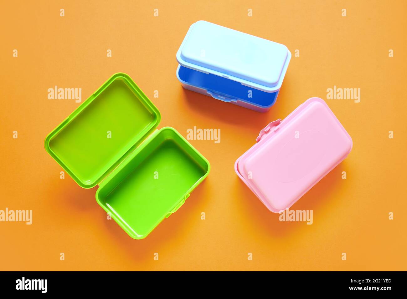 Plastic lunch boxes on color background Stock Photo - Alamy