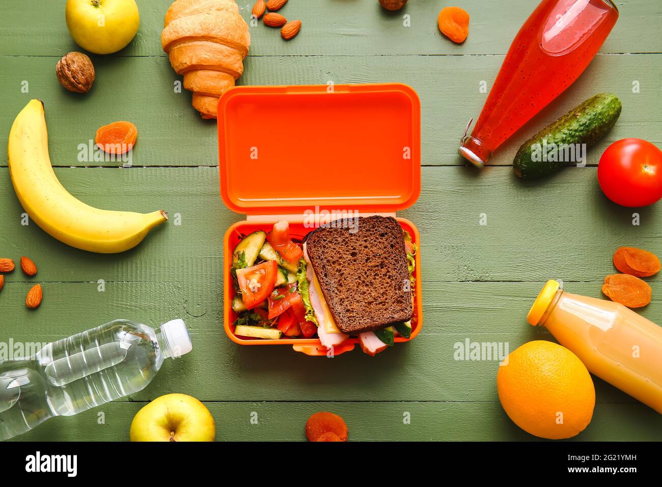 Lunch box with tasty food on wooden background Stock Photo - Alamy