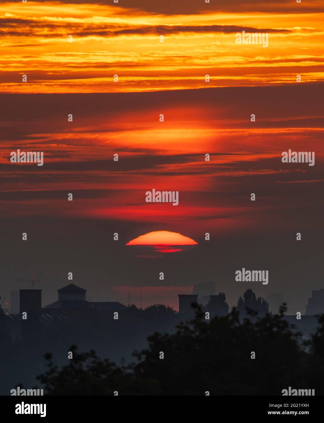 London, UK. 8 June 2021. The Sun rises at 04.46am through cloud before ...