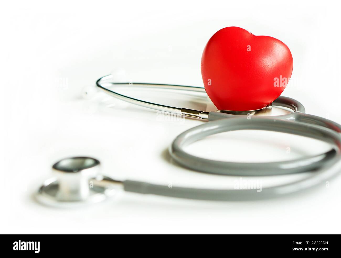 A heart with a stethoscope lying Stock Photo - Alamy