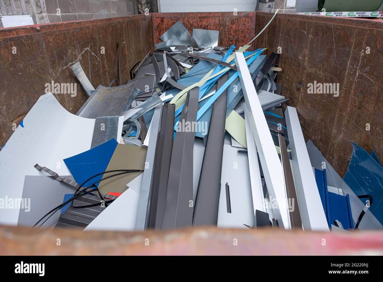 Pile of waste metal in recycle bin Stock Photo - Alamy
