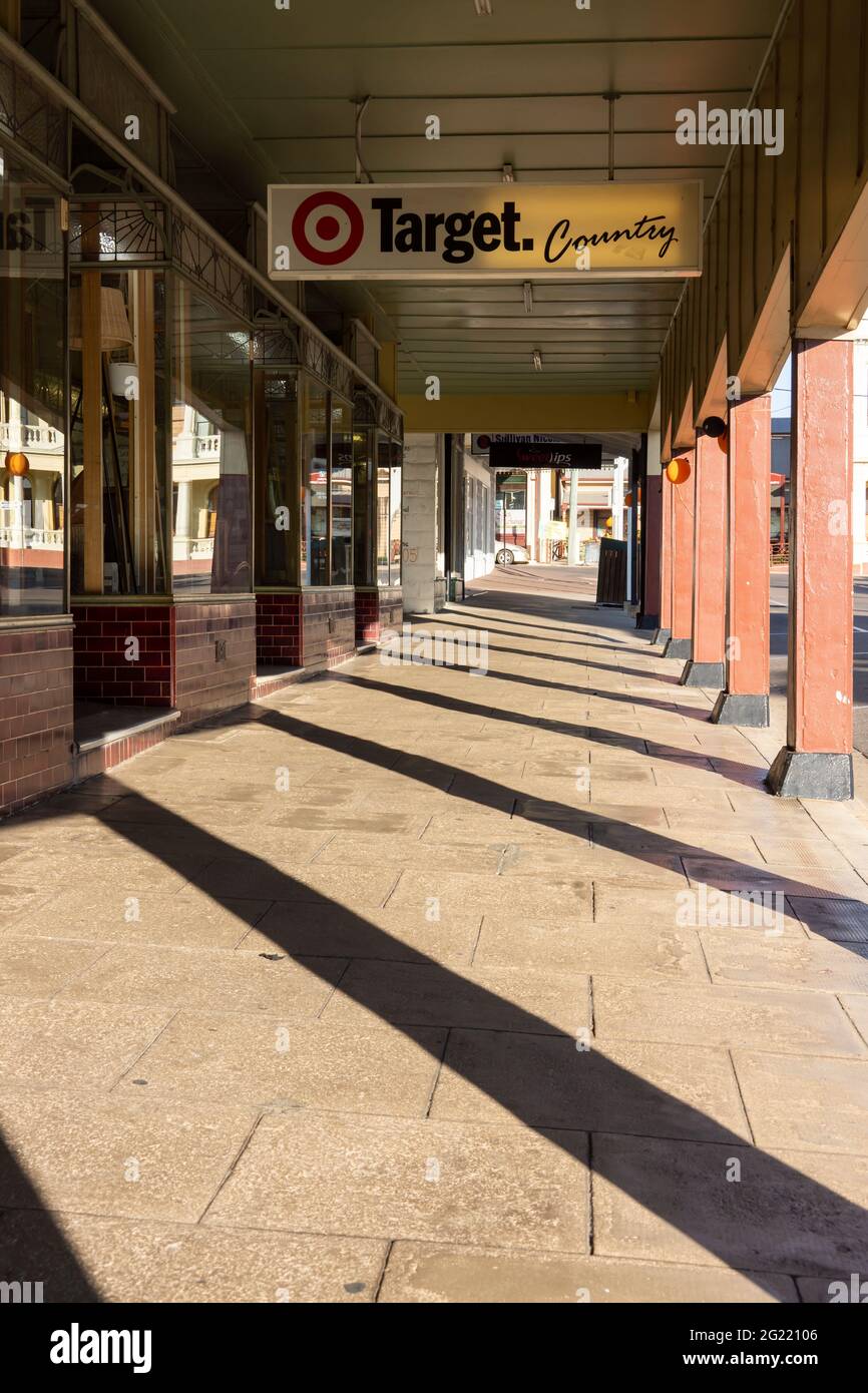 A lit sign for a Target Country Store hanging from the shade awning ...