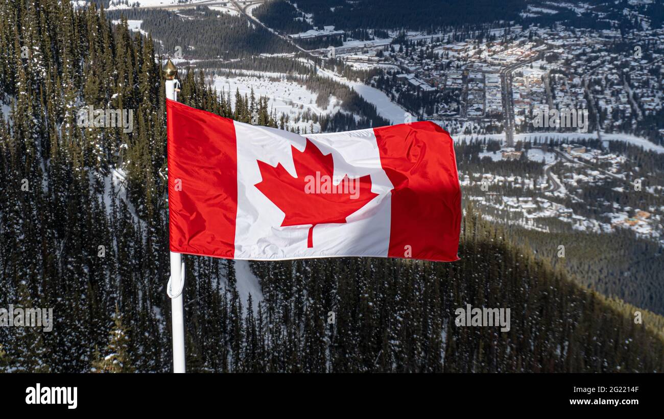 Canadian Maple Leaf national Flag flying over Banff Stock Photo - Alamy