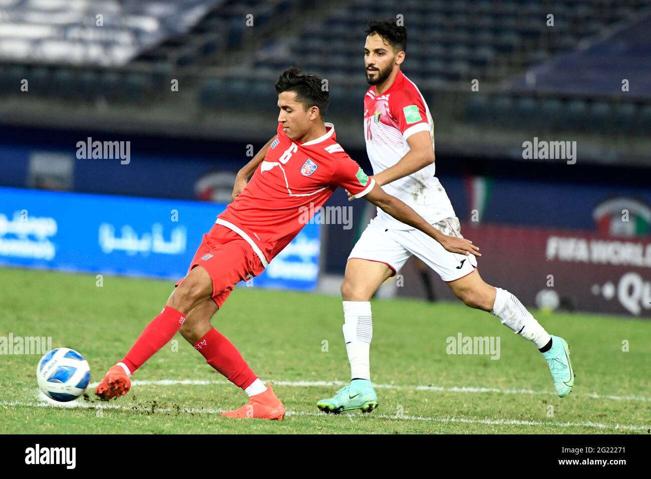 Kuwait City, Kuwait. 7th June, 2021. Suman Aryal (L) of Nepal vies with ...