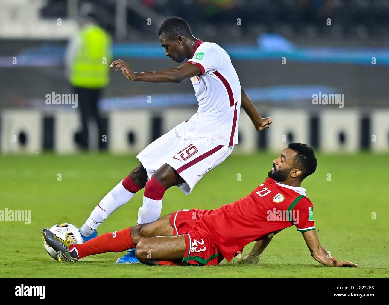 Doha, Qatar. 7th June, 2021. Almoez Ali (L) of Qatar vies with Harib Al ...