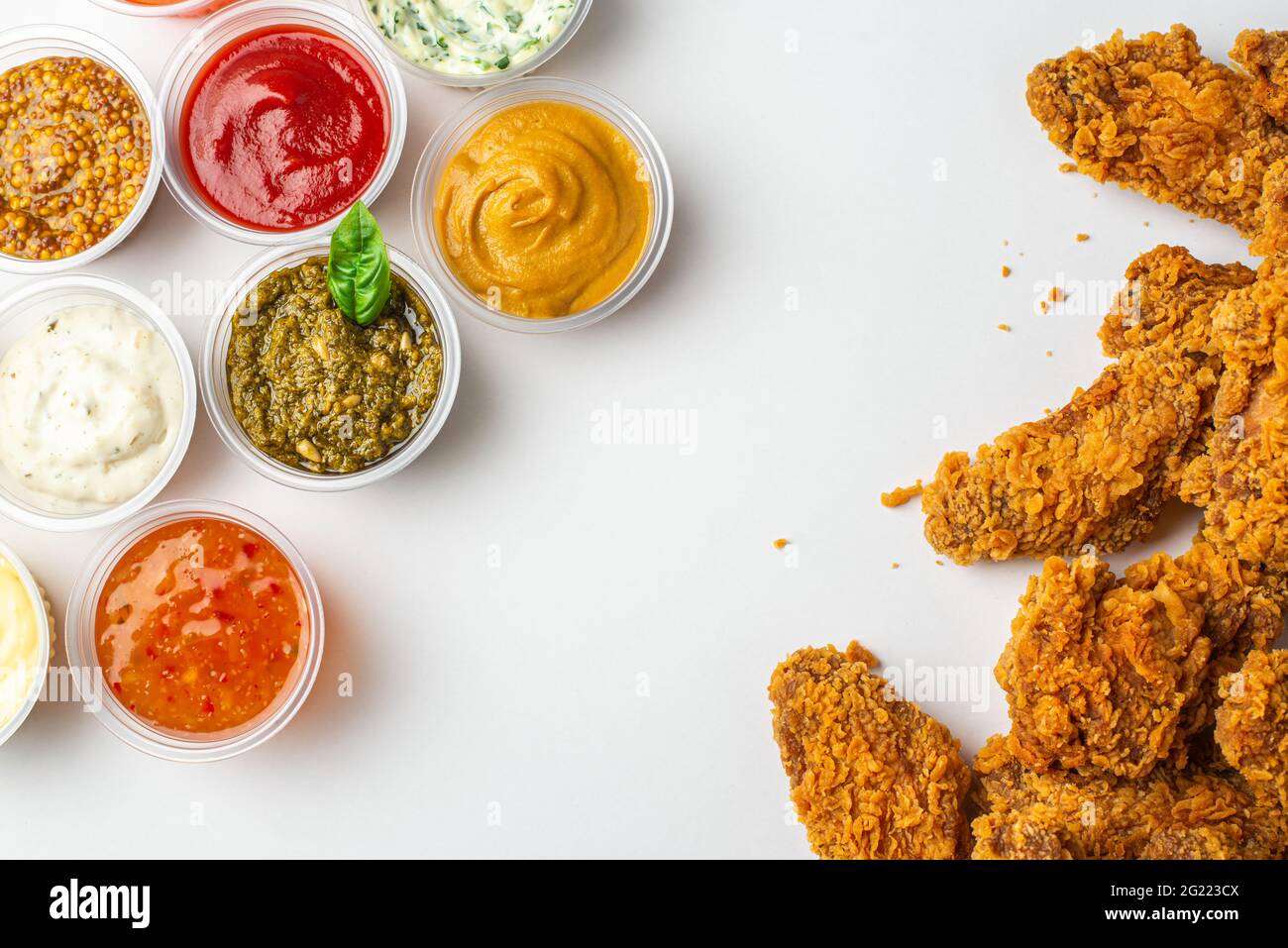 Chicken wings and assorted sauces on white background Stock Photo - Alamy