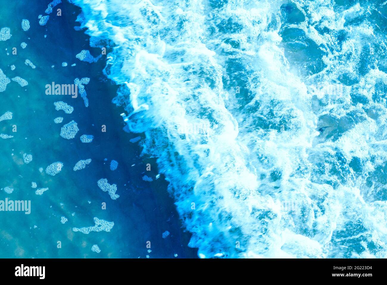 Areal shot of deep blue and rough sea with lot of sea spray.Blue ...