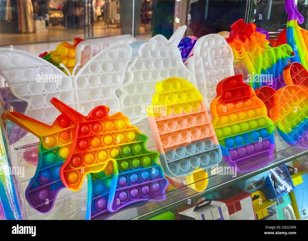 A lot of anti-stress toys Pop It on the shop window in the shopping ...