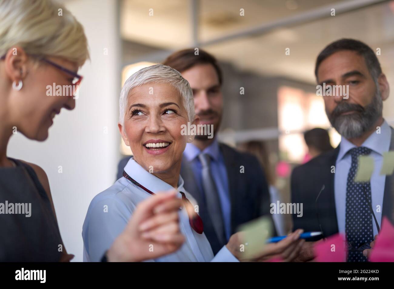 Business colleagues in conference meeting room during presentation ...