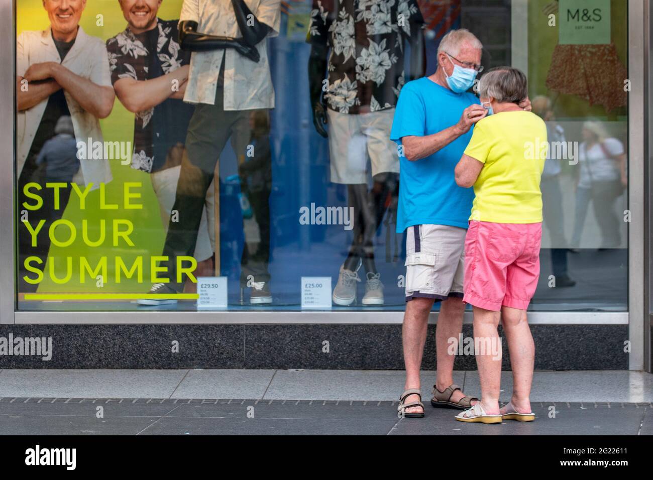 Summer fashion style outsde Marks & Spencers, M&S shoppers preparing to ...