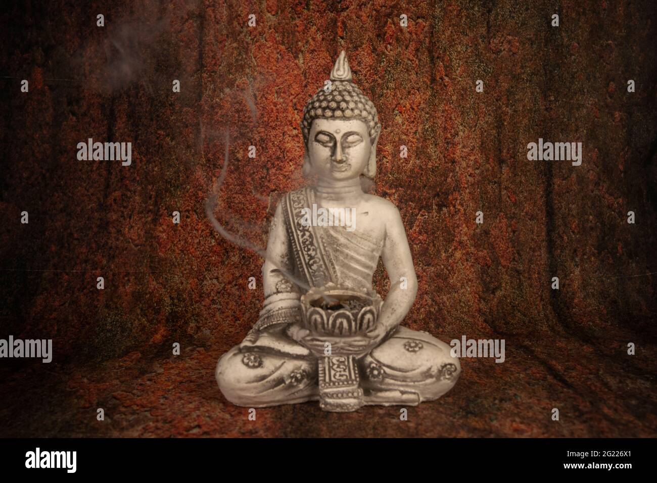 figure of a young Buddha in a state of meditation Stock Photo - Alamy