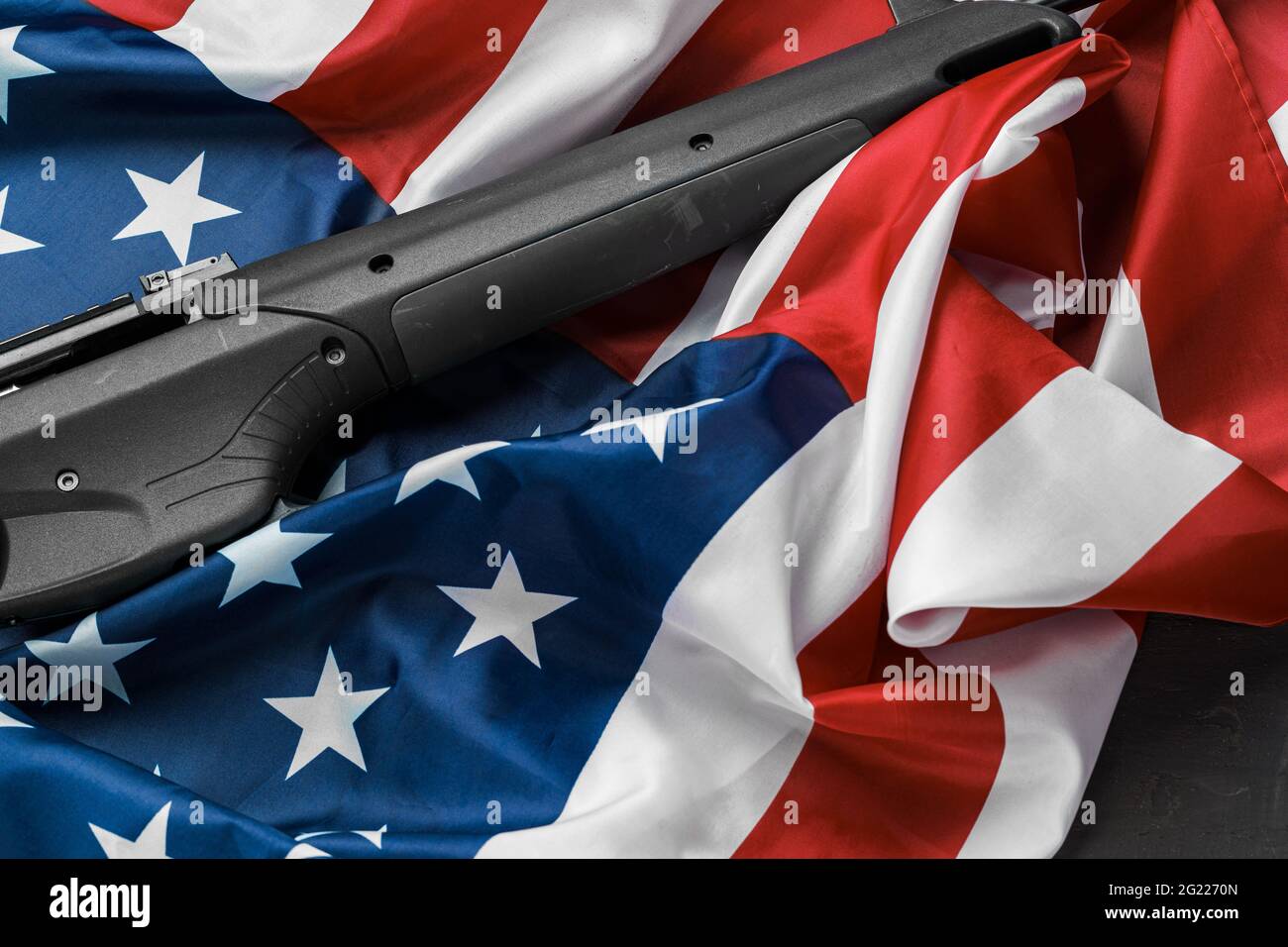 Automatic rifle on USA flag on wooden background Stock Photo - Alamy