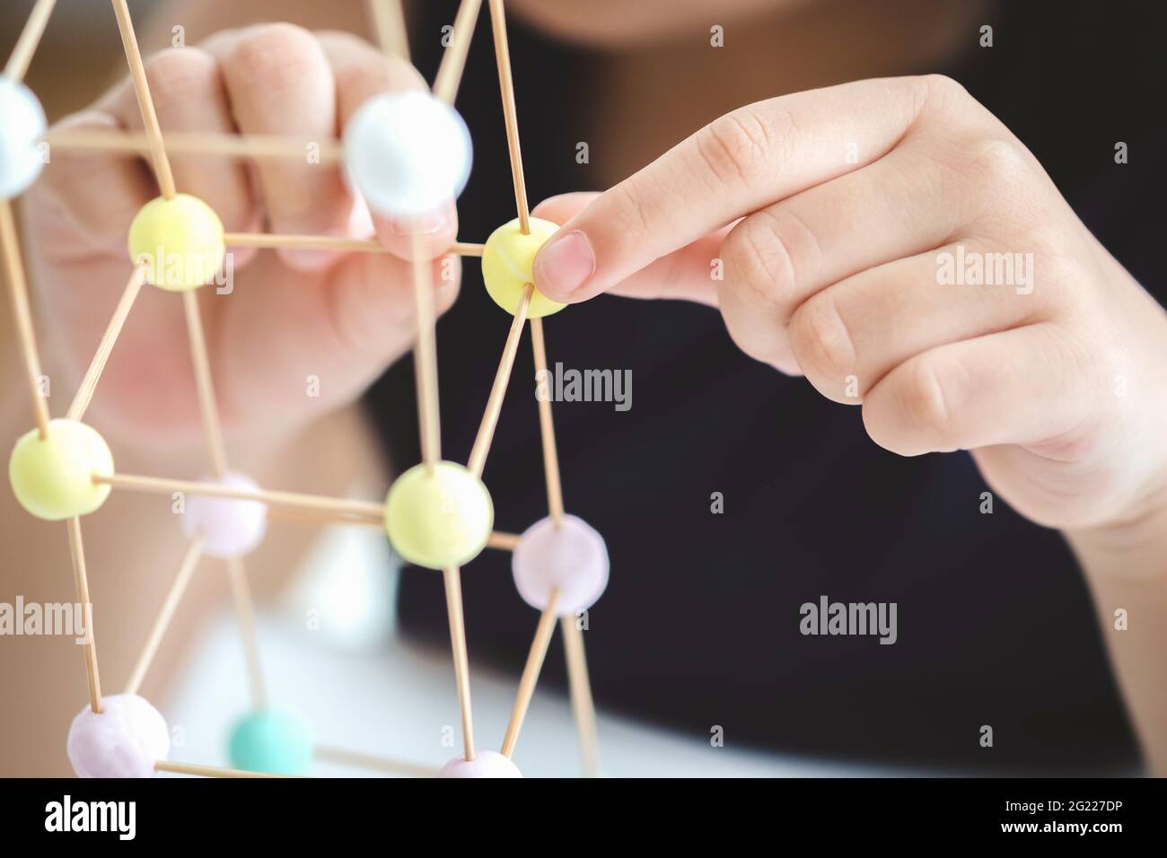 STEM education, Close up hands, child learning making 3D geometric ...