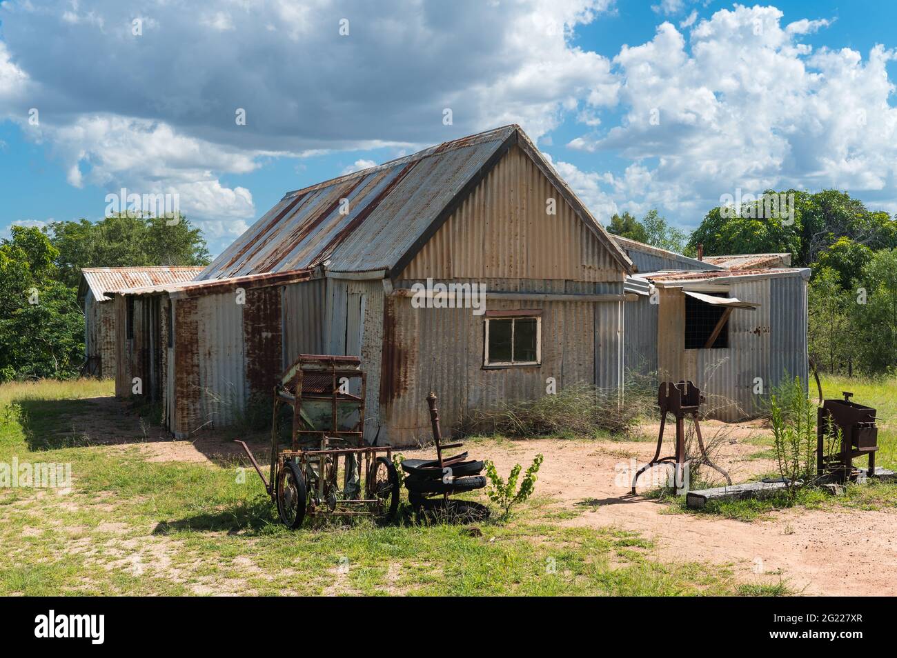 An old restored miners corrugated iron house with foreground mine ...
