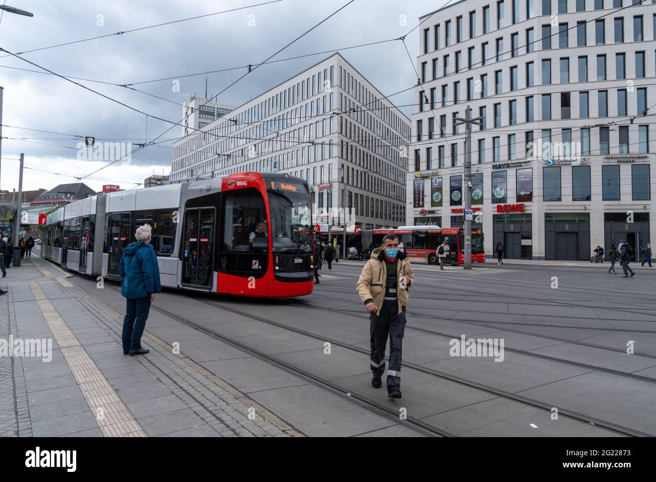 Bremen, Germany - May 25, 2021: trams and many commuters at the central ...