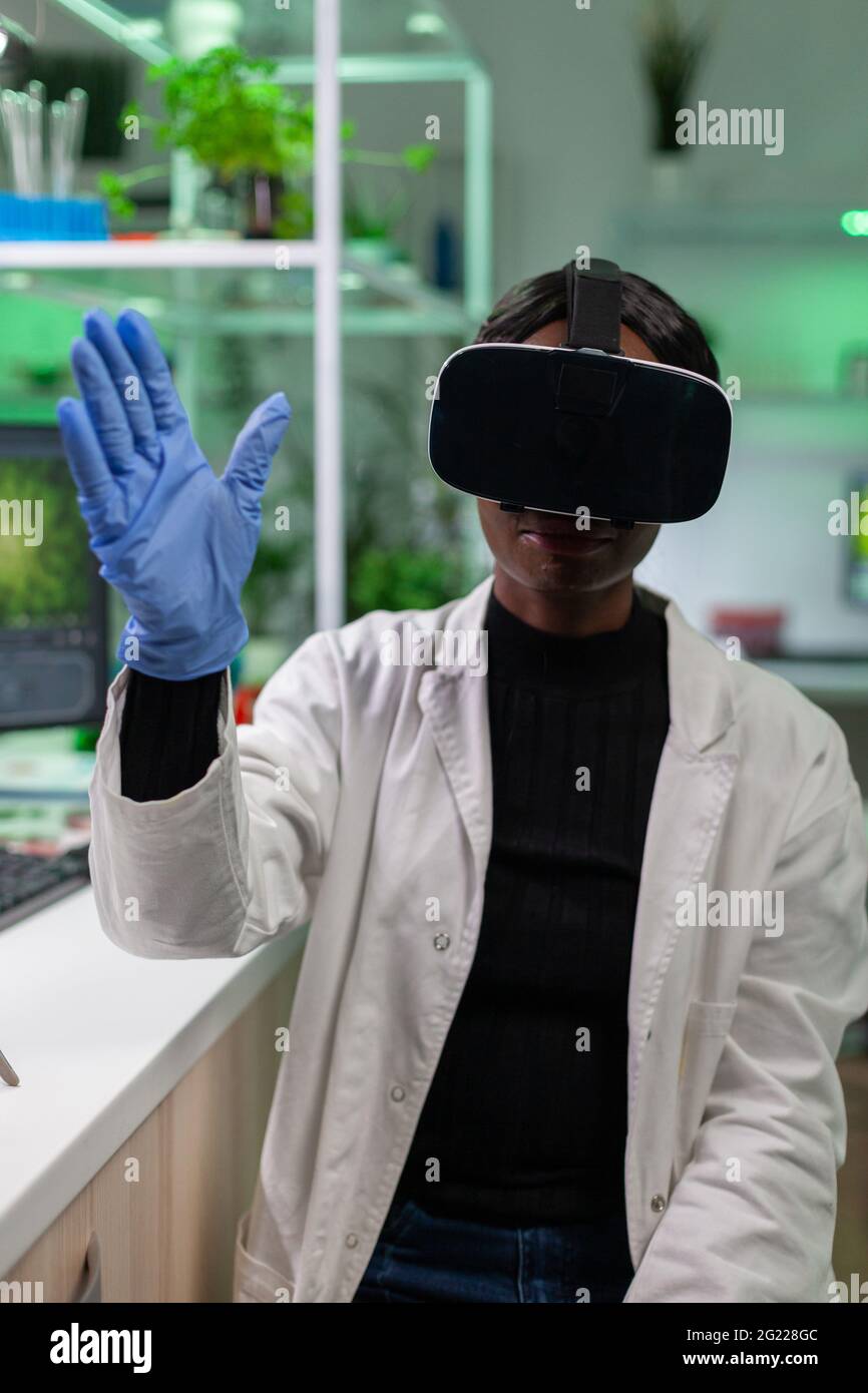 African scientist biologist conducting research using virtual reality ...