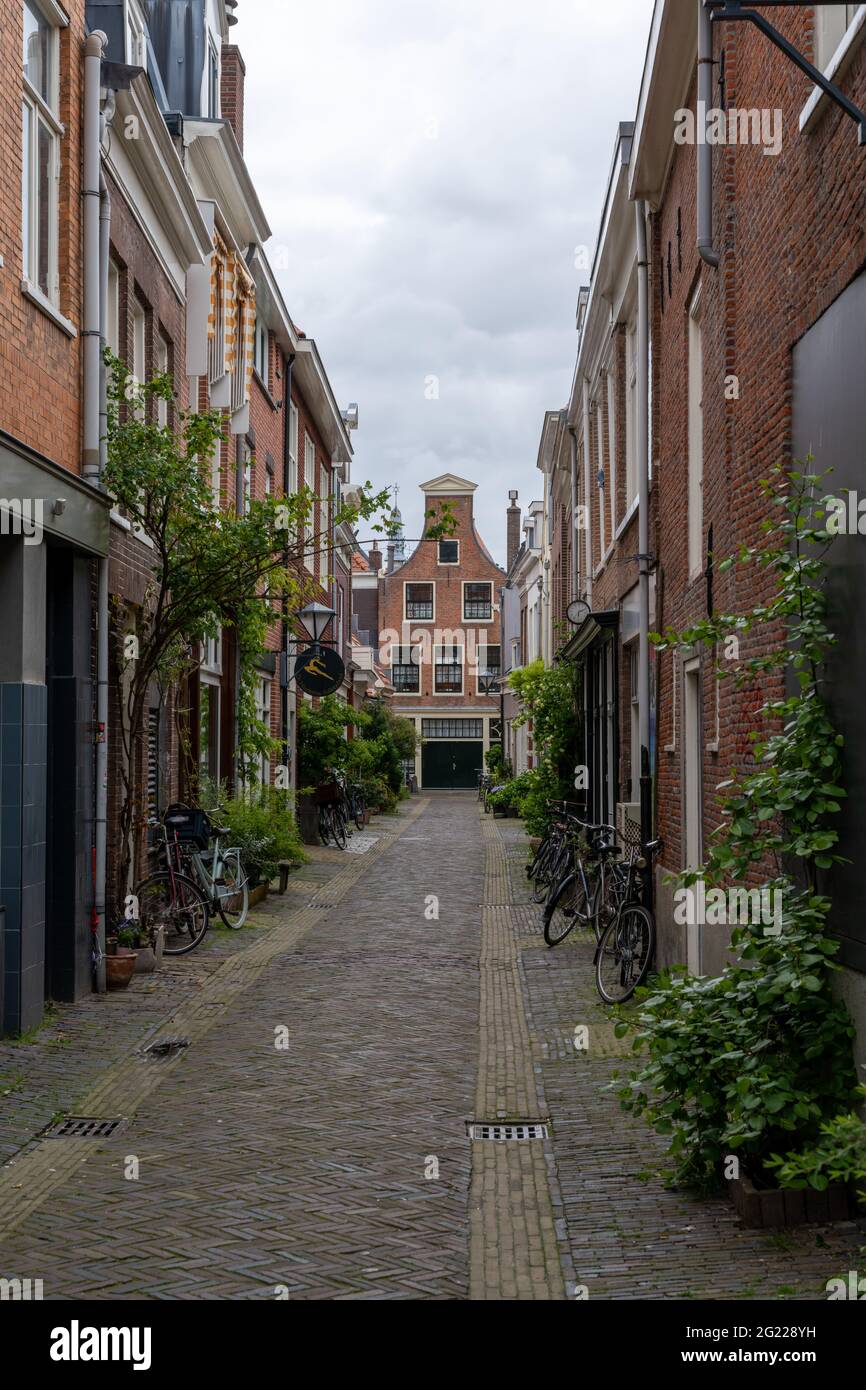 Haarlem, Netherlands - 21 May, 2021: narrow cobblestone street with ...