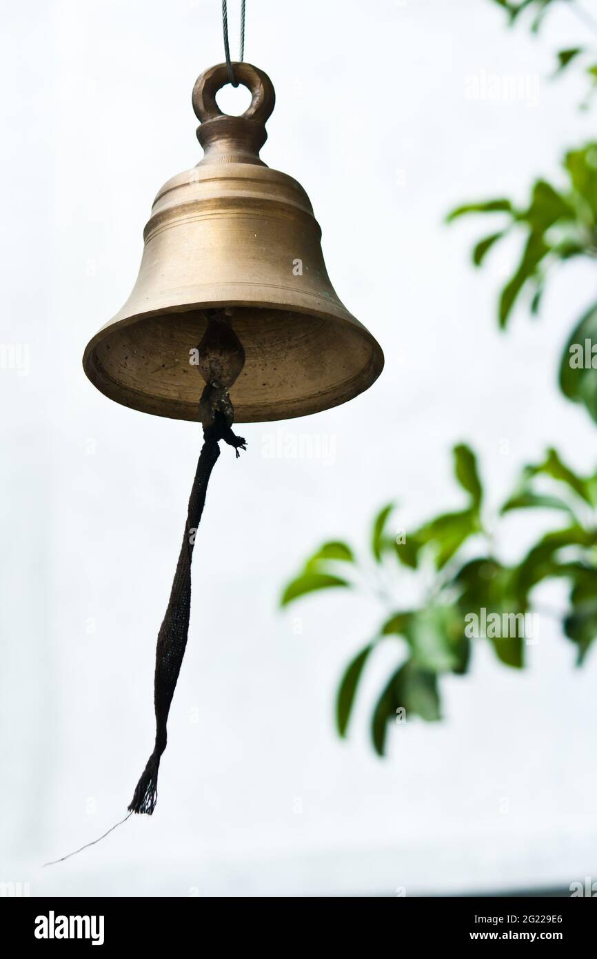 Tradition buddhist wishing bell with green leaves background Stock ...