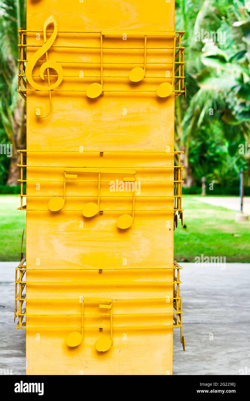 Yellow musical notes on the yellow pole Stock Photo - Alamy
