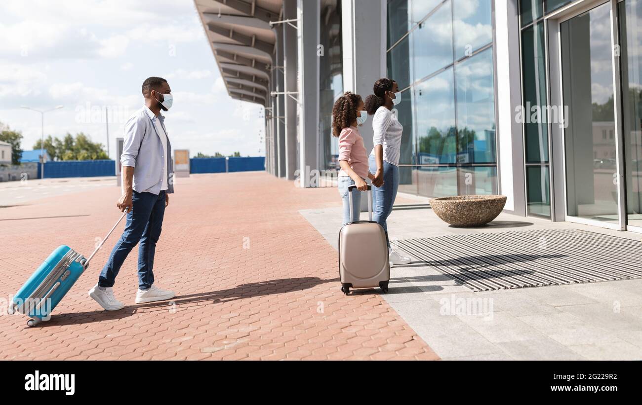 Black people travelling, walking in airport, side view Stock Photo - Alamy