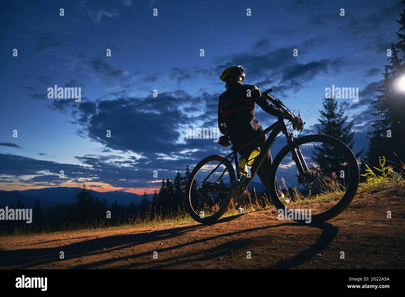 Bike rider resting on bicycle hi-res stock photography and images - Alamy