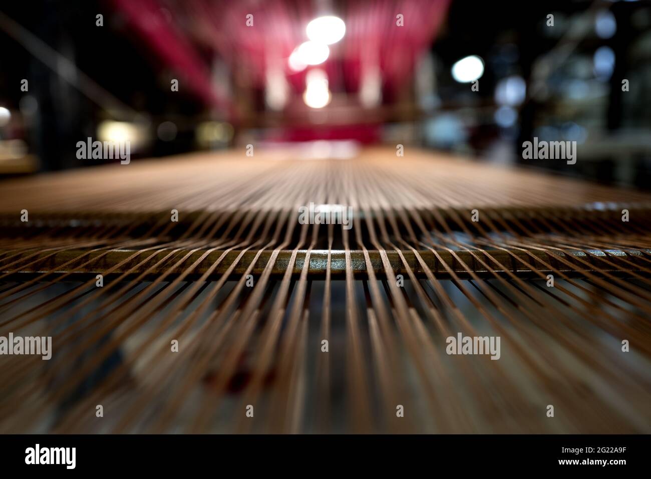Golden thread on a vintage loom at the historical Bevilacqua weaving in ...