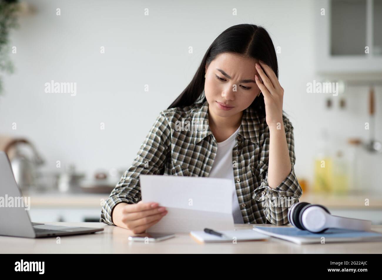 Asian woman sitting kitchen hi-res stock photography and images - Alamy