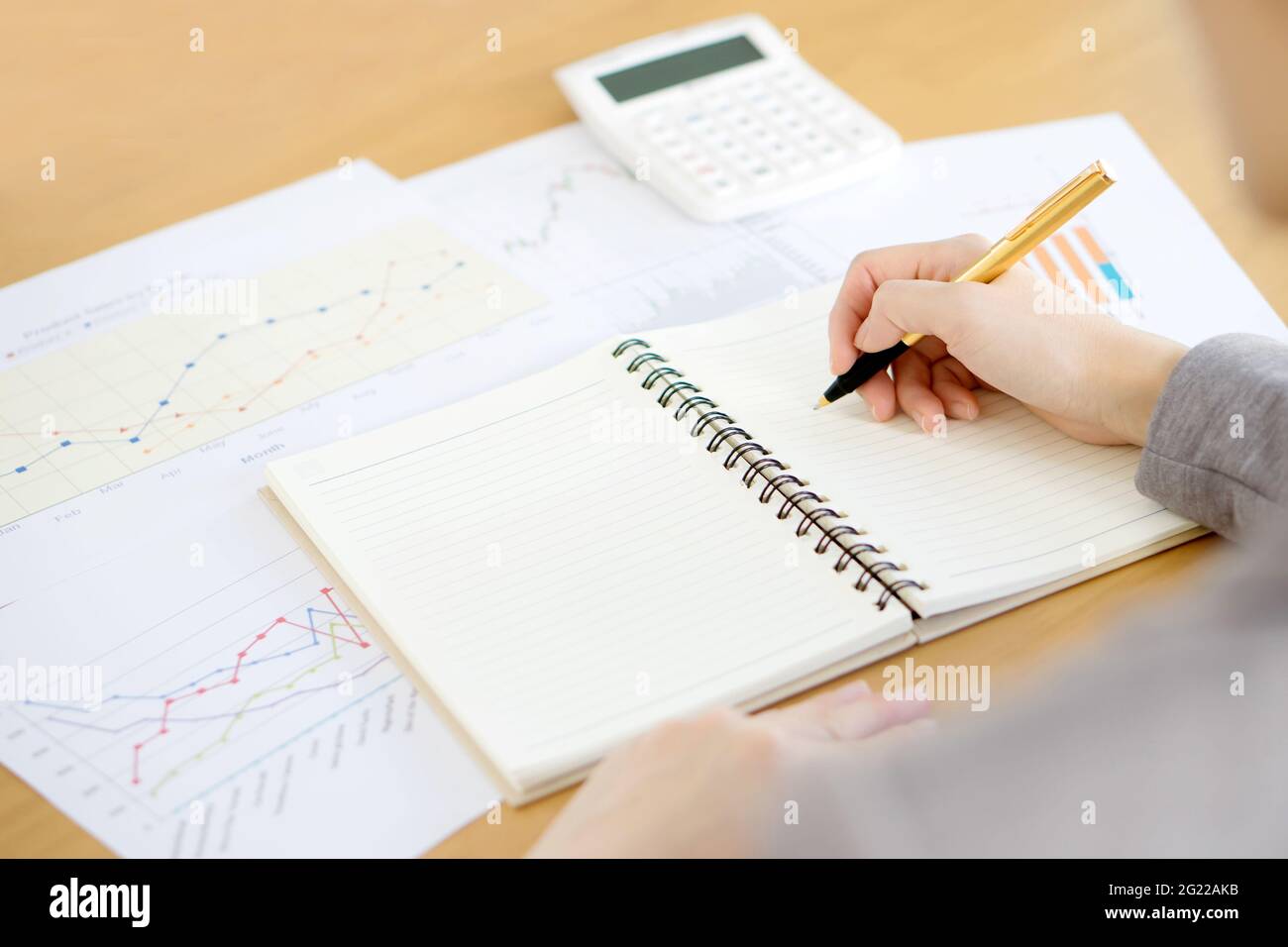 picture of woman hand with calculator and papers Stock Photo - Alamy