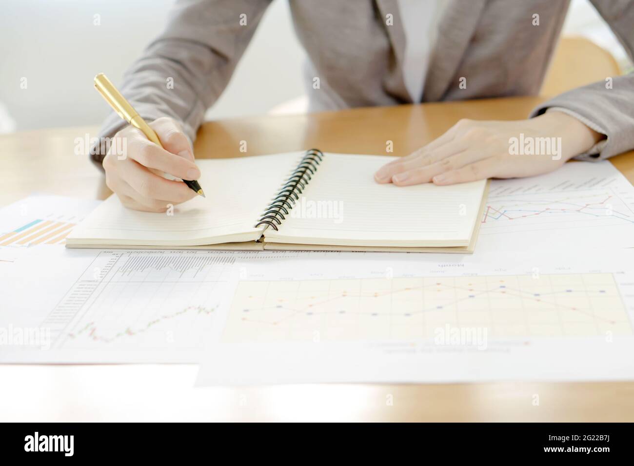 picture of woman hand with calculator and papers Stock Photo - Alamy