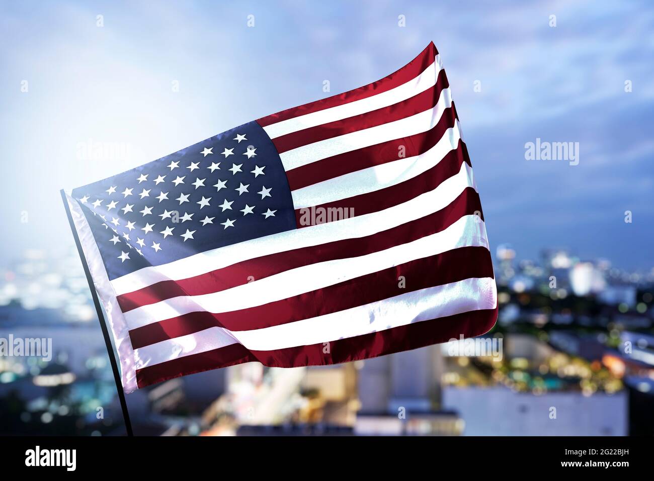 American flag waving in the air with a sky background. Fourth of July ...