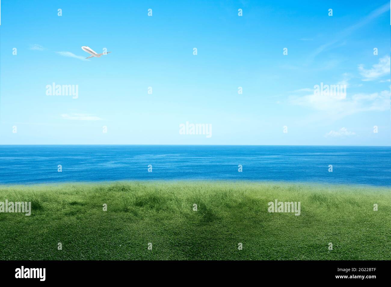 The scenery of green grass on the beach with seascape background Stock ...