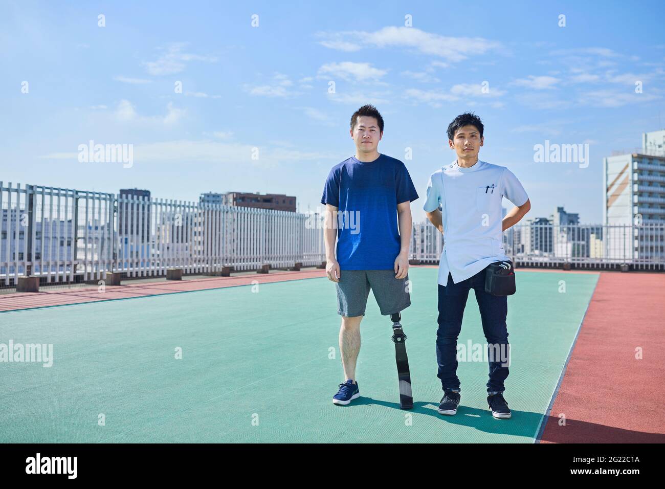 Japanese prosthetist working with amputee on rooftop Stock Photo - Alamy