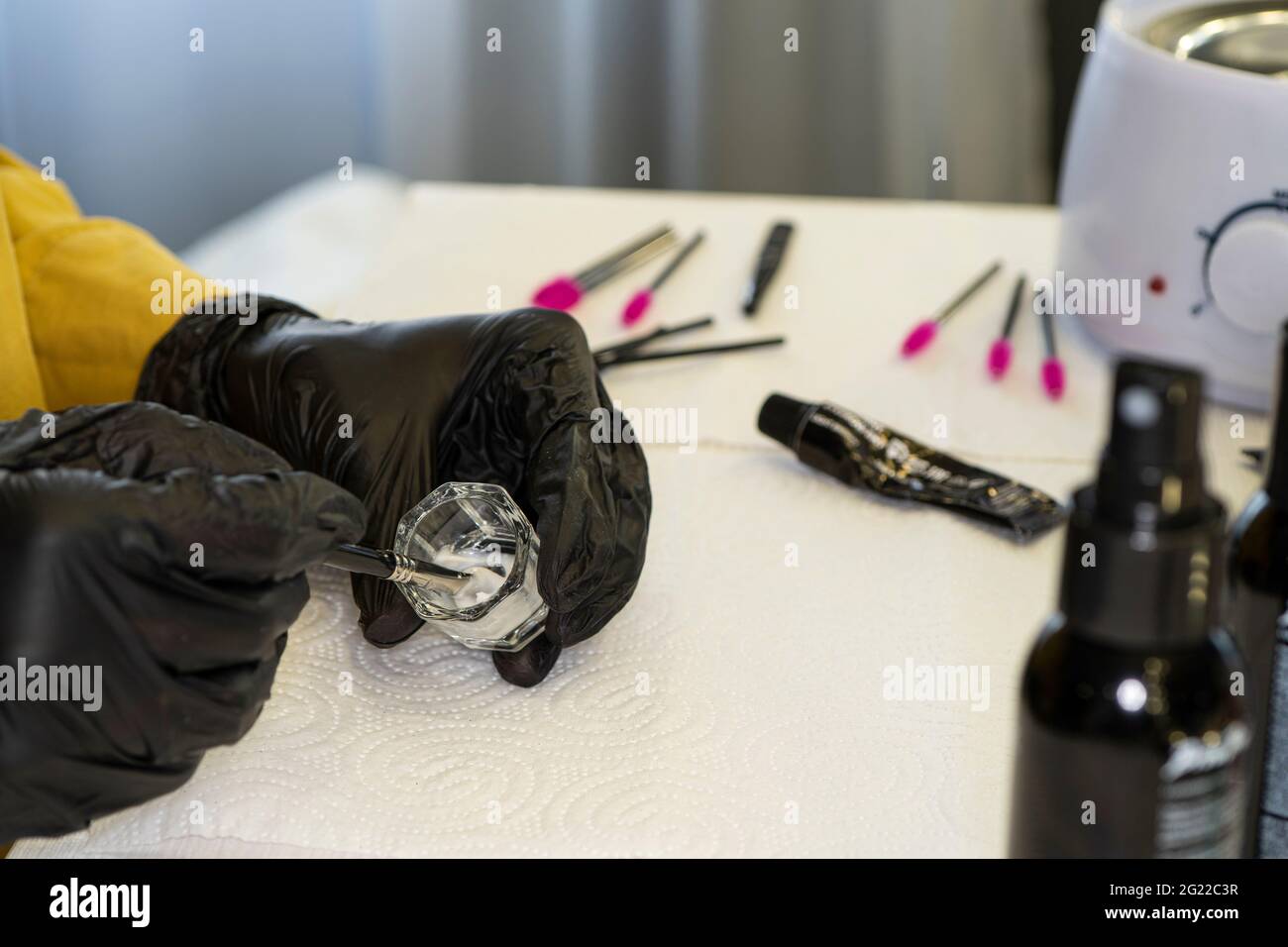 Eyebrow Waxing Procedure. master interferes with a stick with heated ...