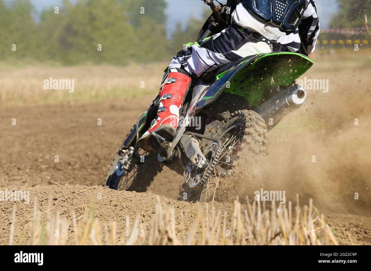 motocross racer accelerating speed in track Stock Photo - Alamy