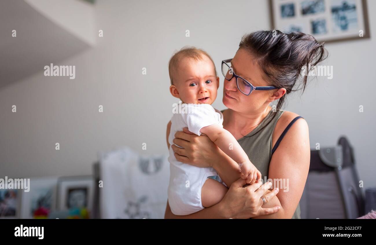happy mother holding her baby Stock Photo - Alamy