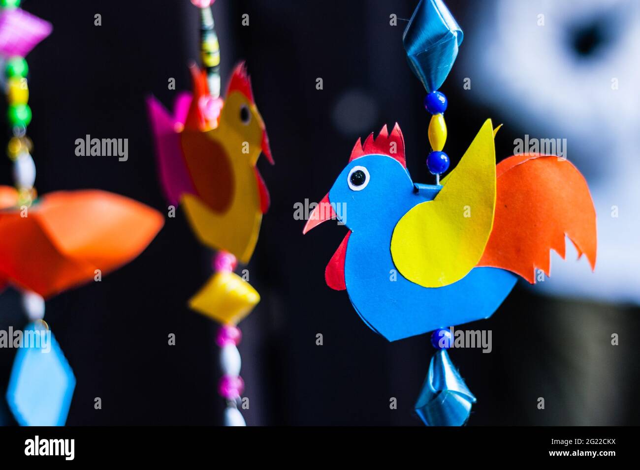 cute handicraft chicken mobile made from colored paper Stock Photo - Alamy