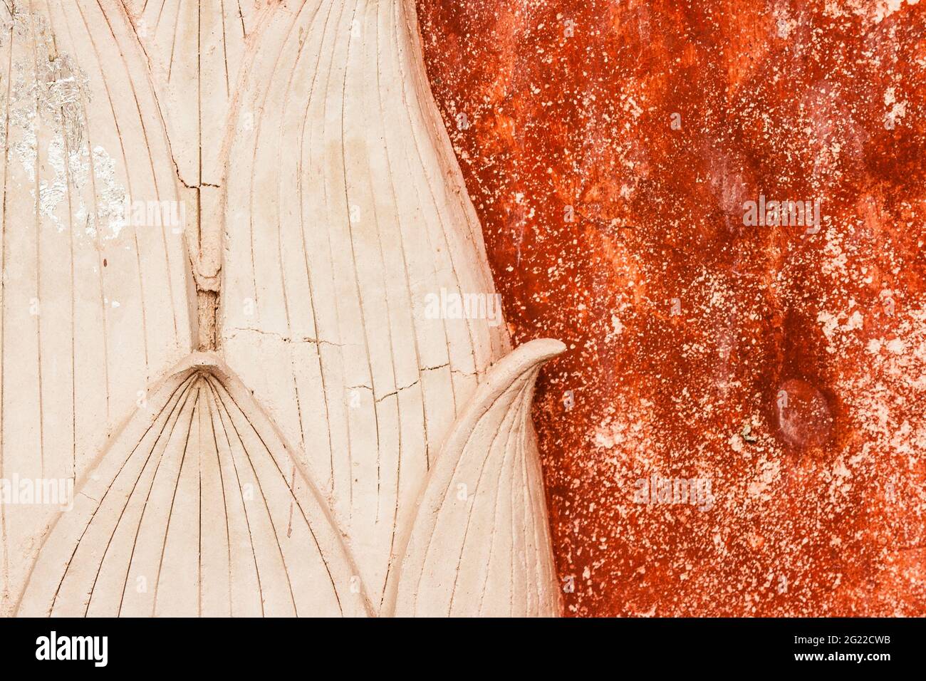 Lotus cement sculpture with grunge red background Stock Photo - Alamy
