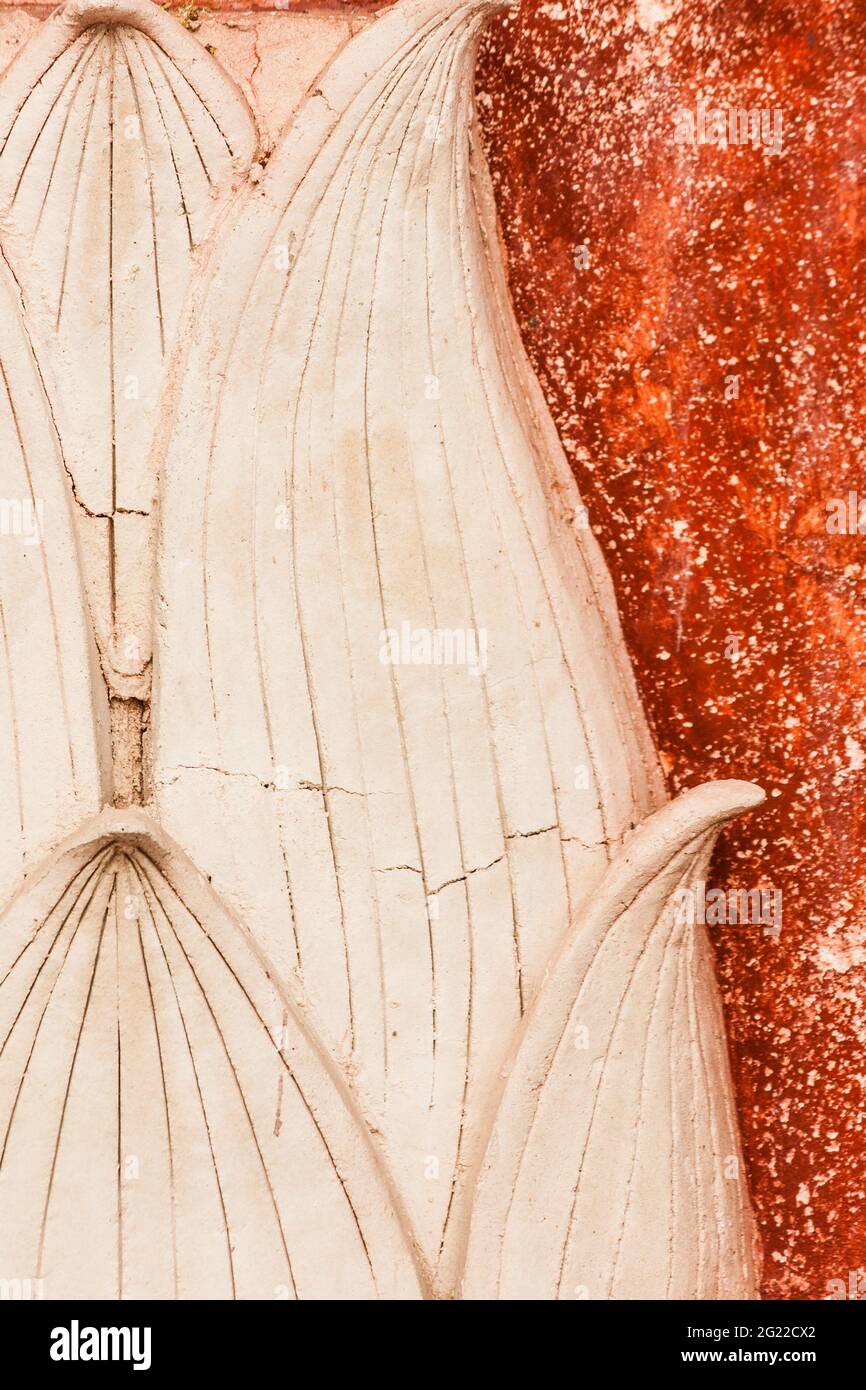 Lotus cement sculpture with grunge red background Stock Photo - Alamy