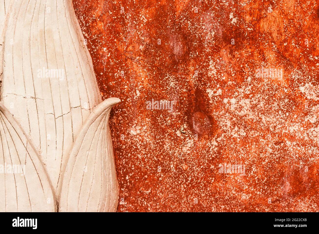 Lotus cement sculpture with grunge red background Stock Photo - Alamy