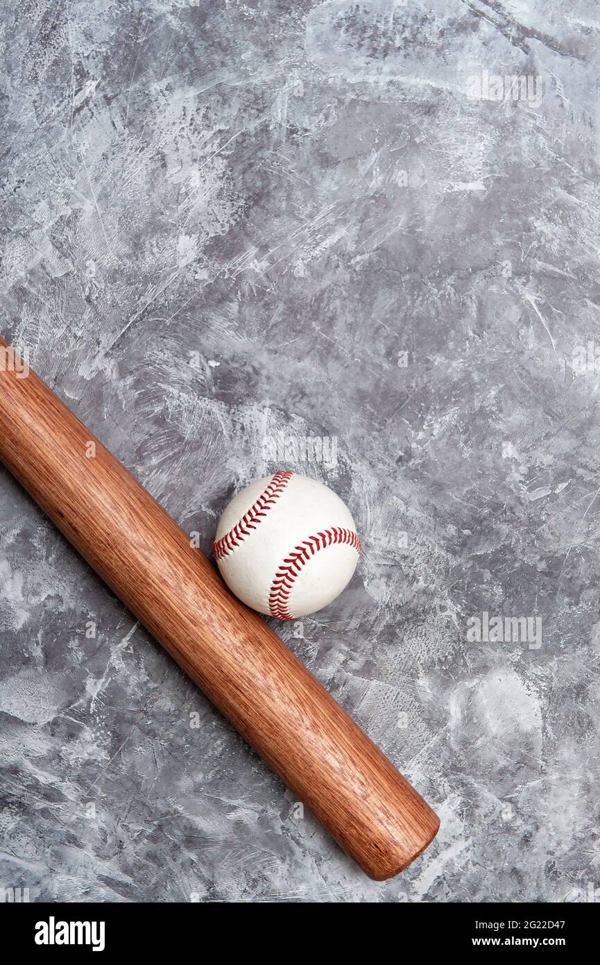 Baseball ball and bat on grey background. Team sport concept Stock ...