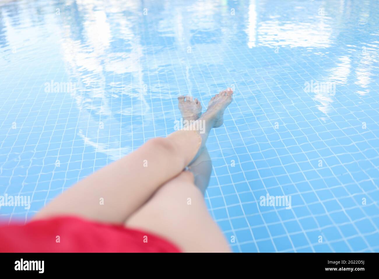 Woman legs sun pool relax hi-res stock photography and images - Alamy